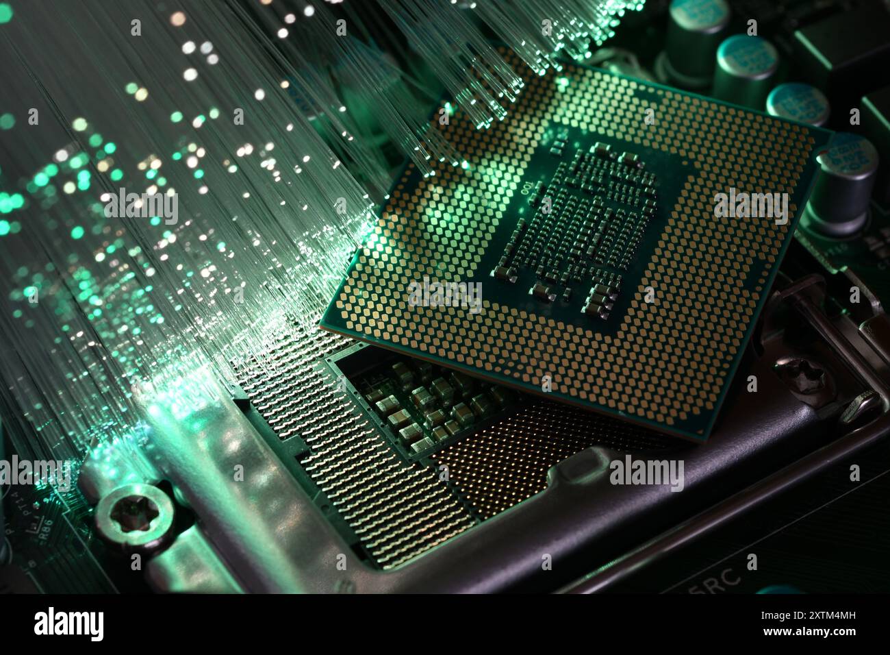 Detail of Detail of the CPU on a PC motherboard illuminated by a fiber ...