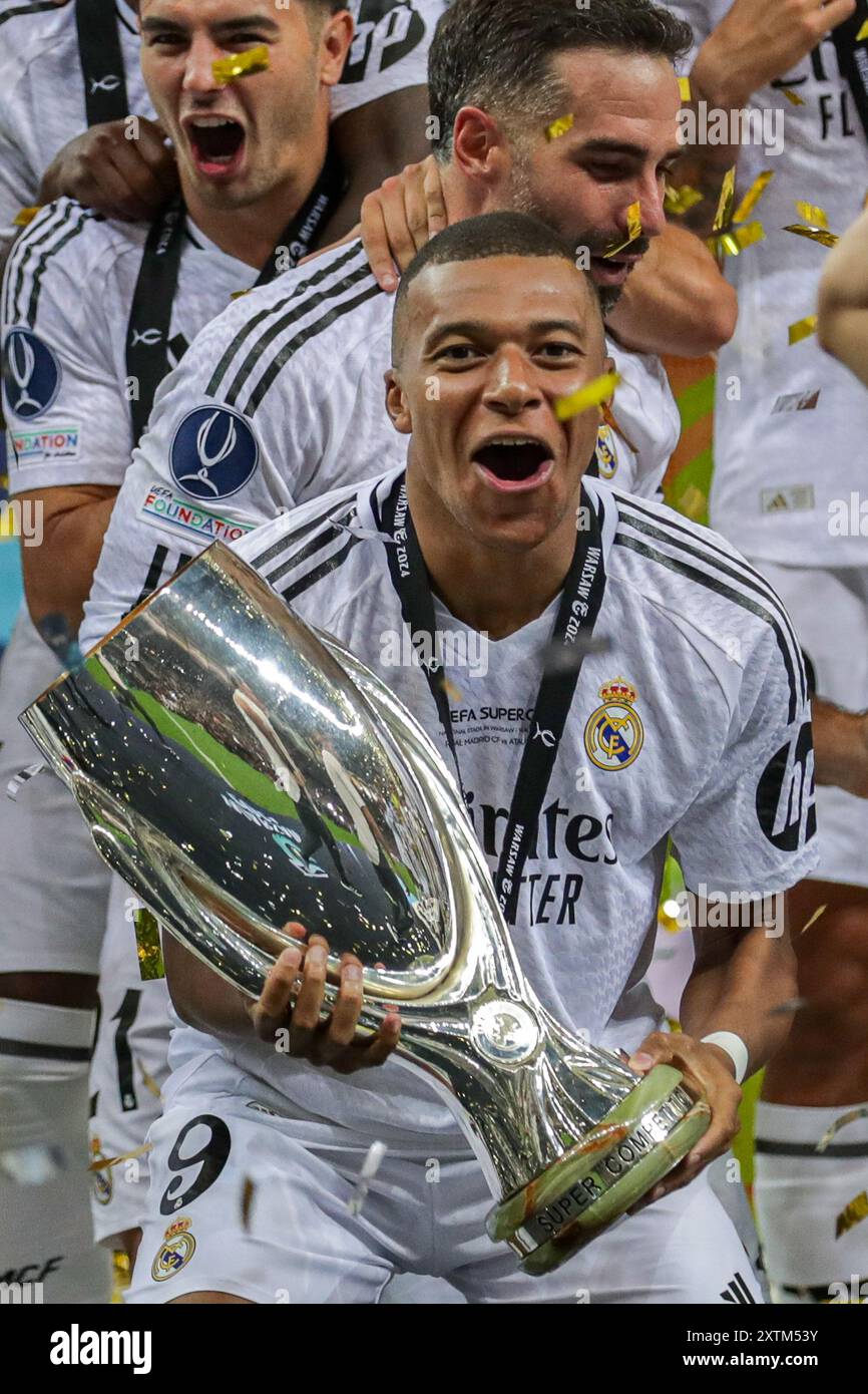 Kylian Mbappe of Real Madrid holds a trophy during the ceremony after the UEFA Super Cup 2024 ...