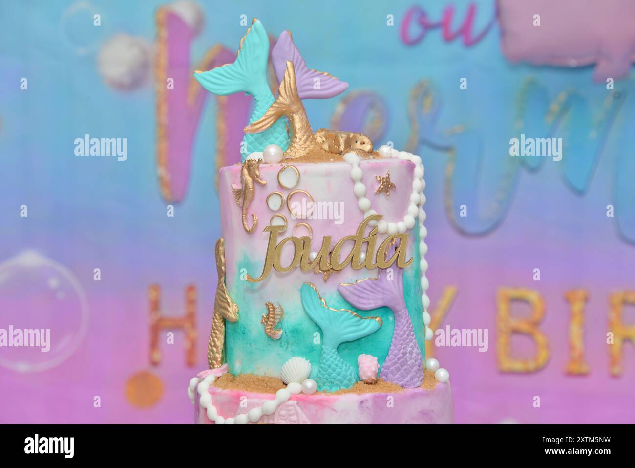 Girls birthday cake with mermaids theme Stock Photo - Alamy