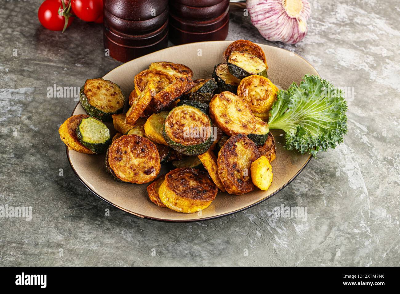 Roasted young zucchini snack in the plate Stock Photo - Alamy