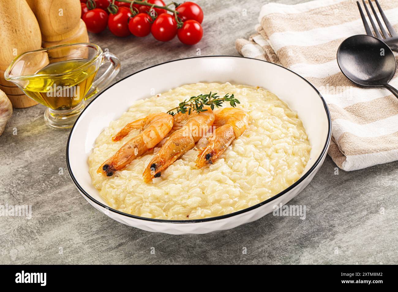 Italian cuisine - risotto with prawn served thyme Stock Photo - Alamy