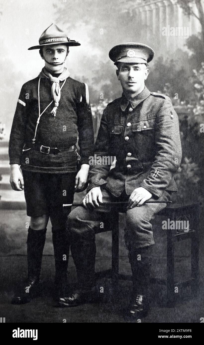 A Boy Scout alongside a soldier in the Northamptonshire Regiment during ...