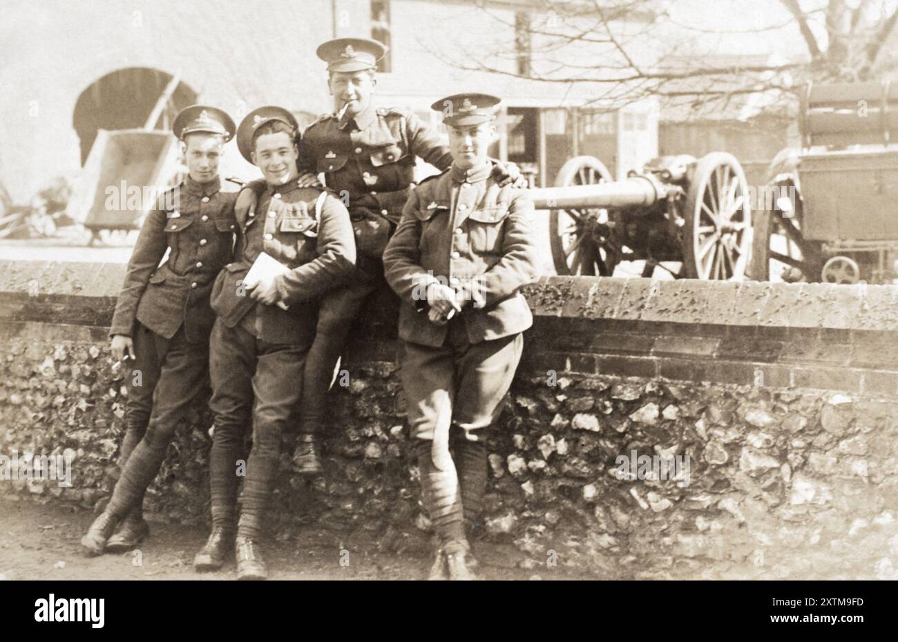Royal Artillery soldiers wearing Territorial Force Imperial Service badges with a 15 punder gun ...