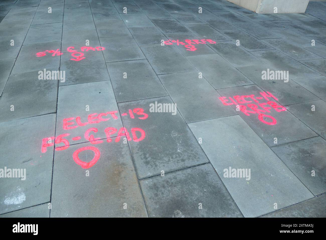 Markers on pavement marking buried utility lines. Oak Park, Illinois ...