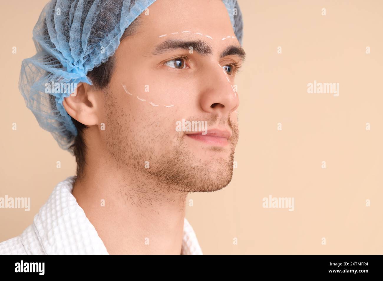 Handsome man with marked face on beige background, closeup. Plastic ...