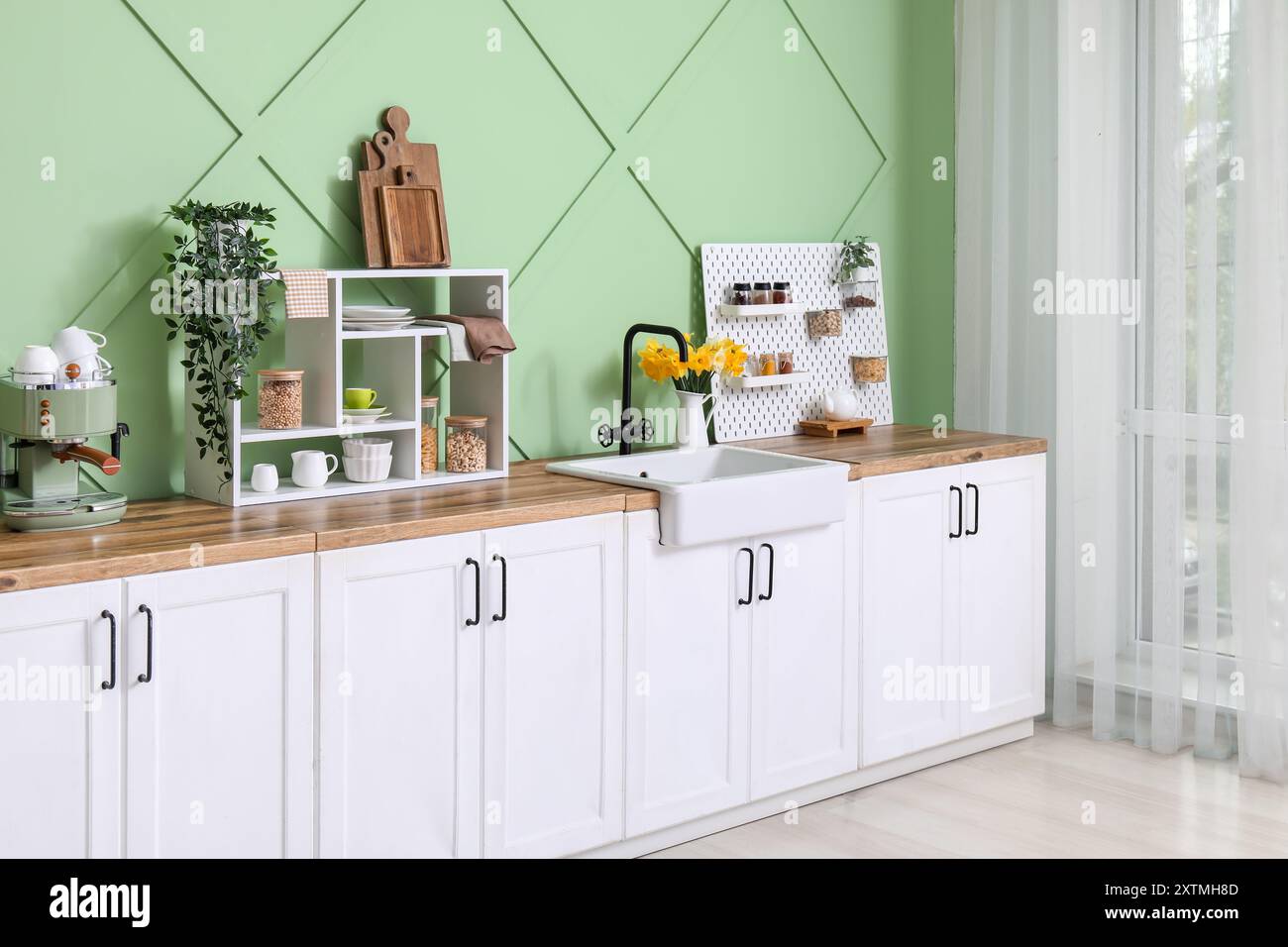 Stylish kitchen with white counters Stock Photo - Alamy