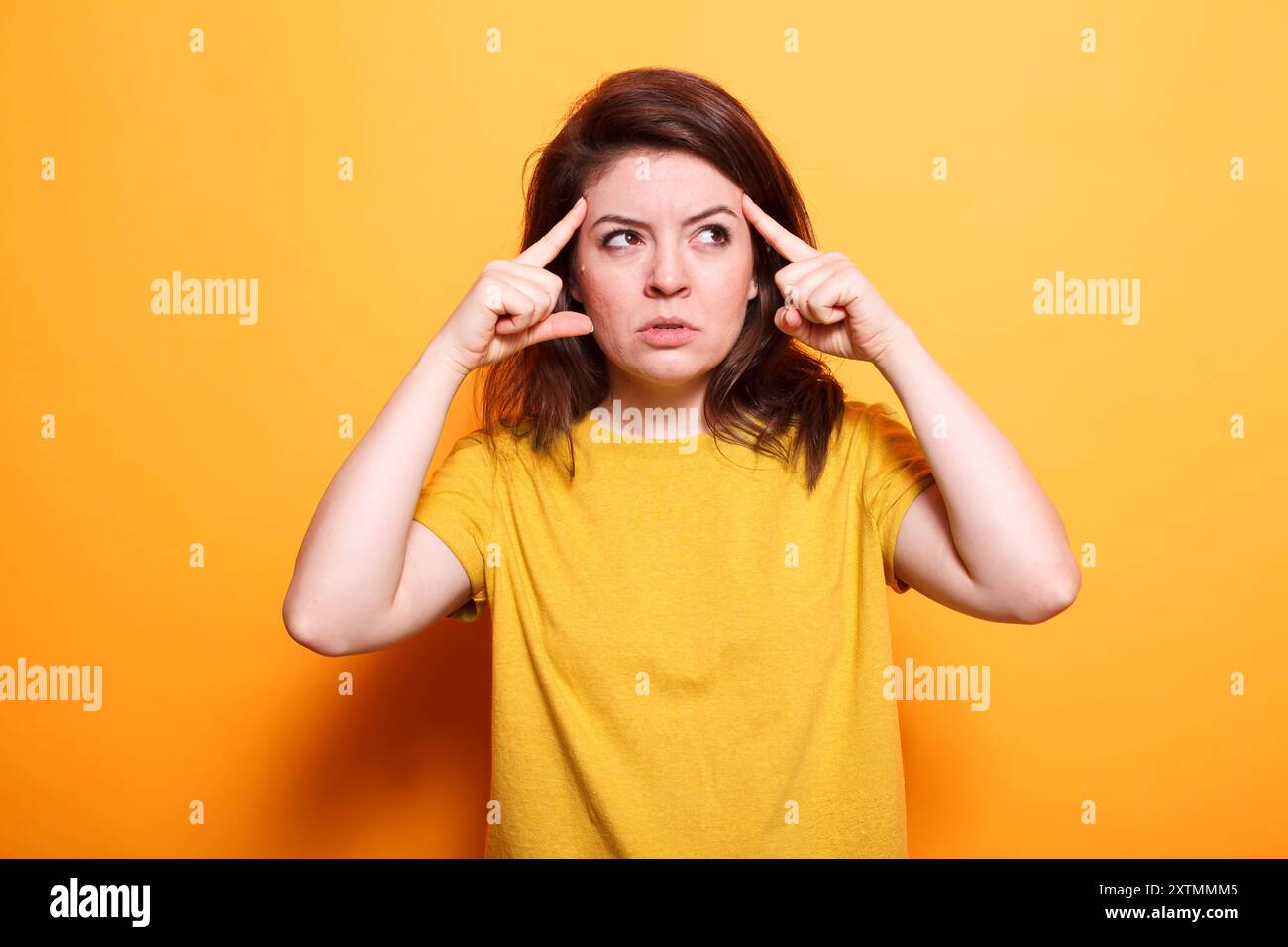 Woman thinking having idea pointing hi-res stock photography and images ...