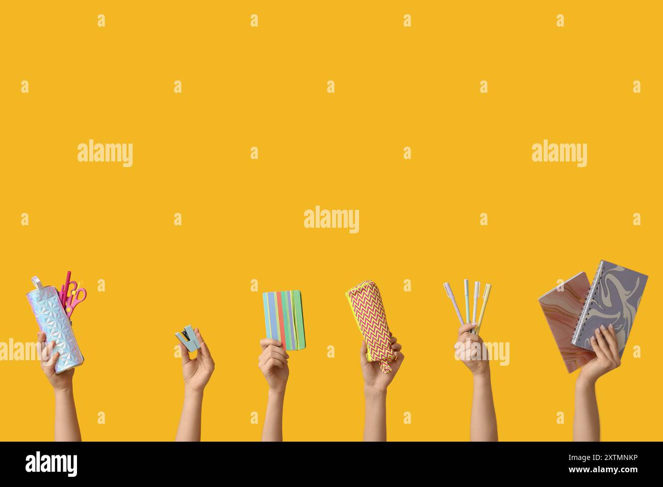 Female hands with different school supplies on yellow background Stock ...