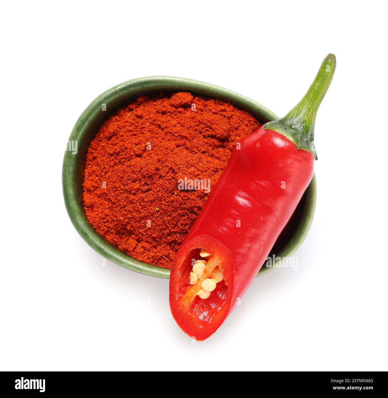 Hot chopped chili pepper and ground on white background Stock Photo - Alamy