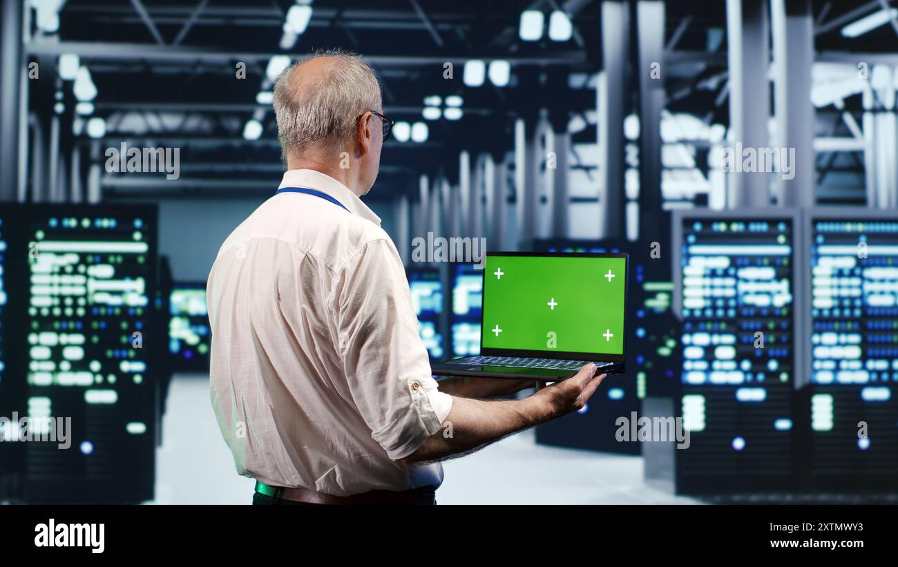 Knowledgeable IT professional navigating network of server racks in ...