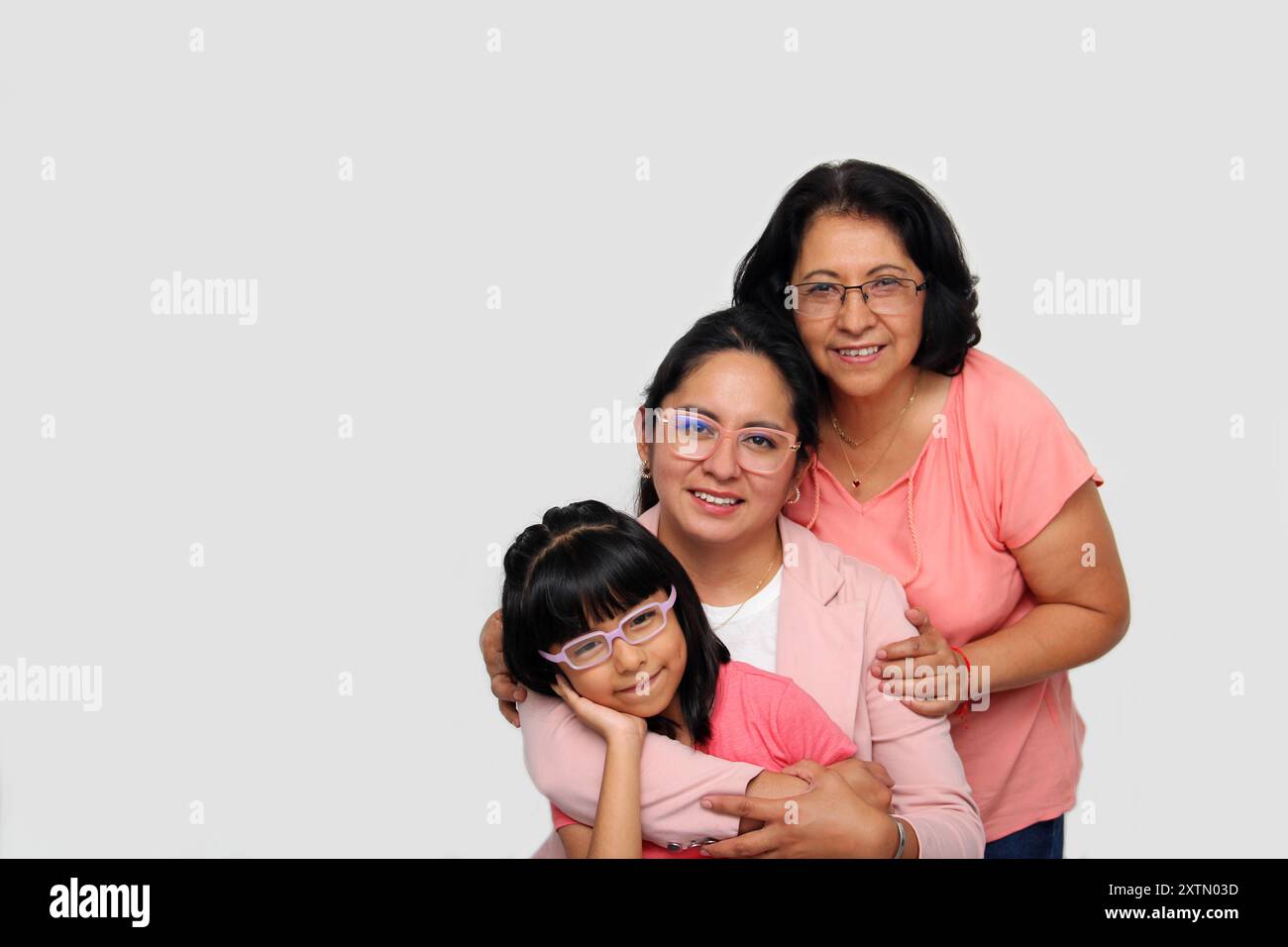 Grandmother, mom and daughter, three generations of dark-skinned Latina ...