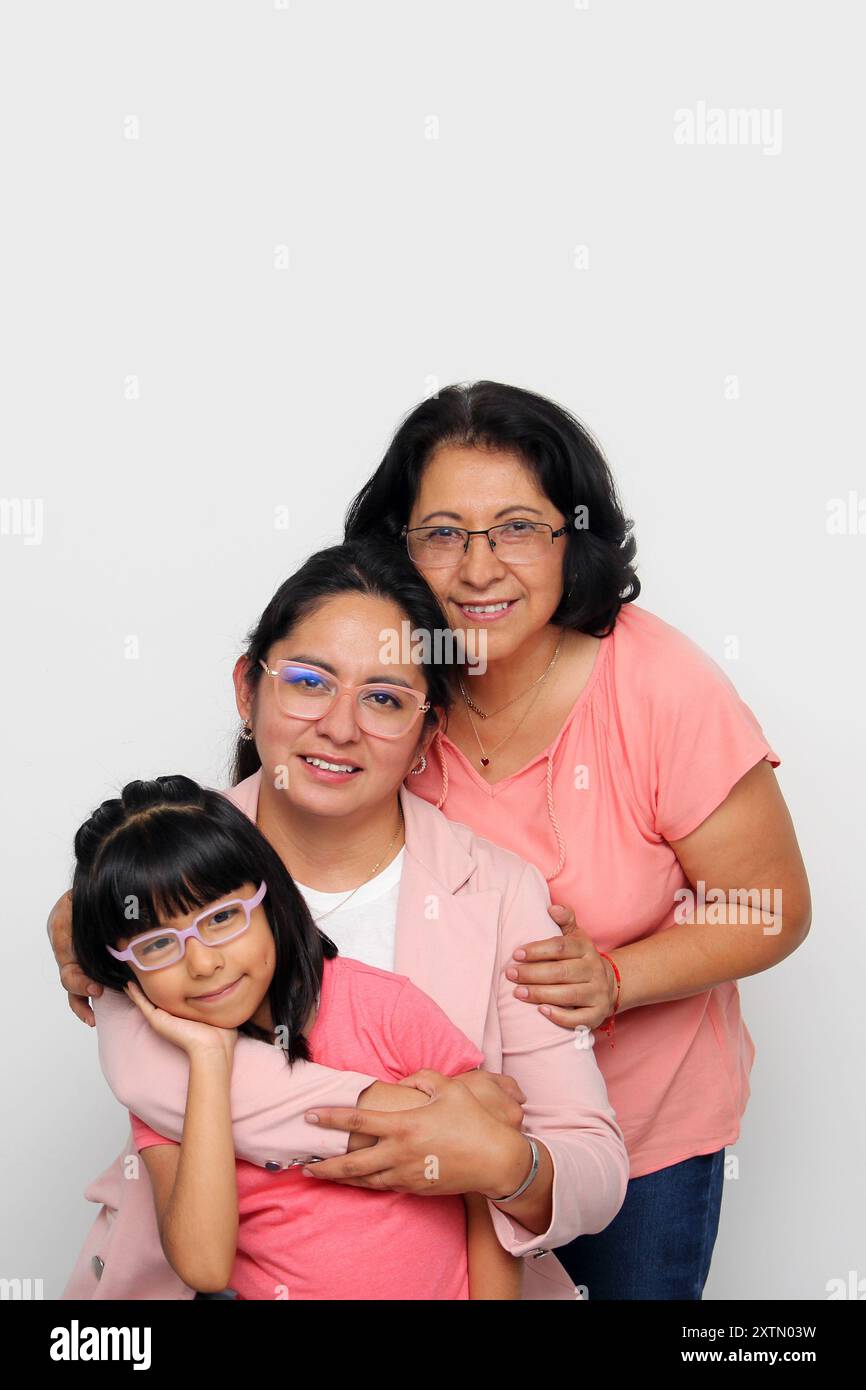 Grandmother, mom and daughter, three generations of dark-skinned Latina ...