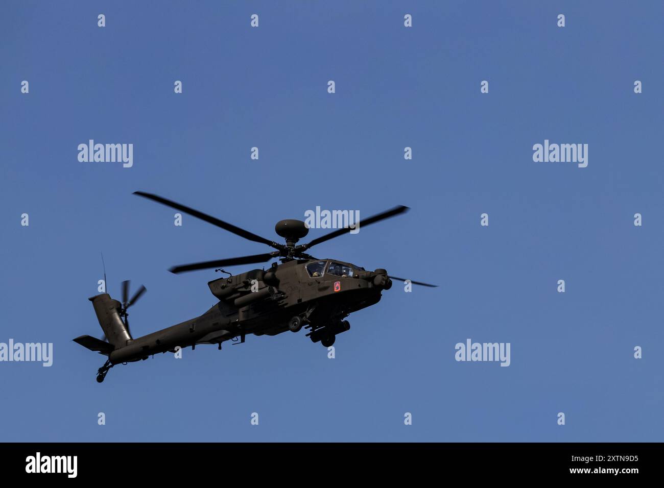 Polish servicemen present AH-64 Apache helicopter in the centre of ...