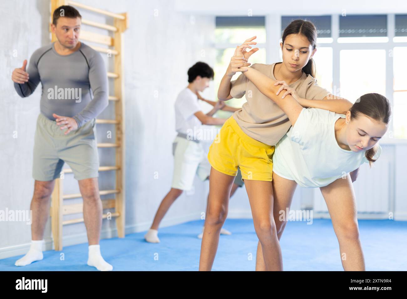 Two girls training self-defense techniques Stock Photo - Alamy
