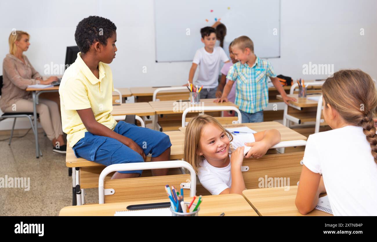 Children pupils talking during recess between lessons Stock Photo - Alamy