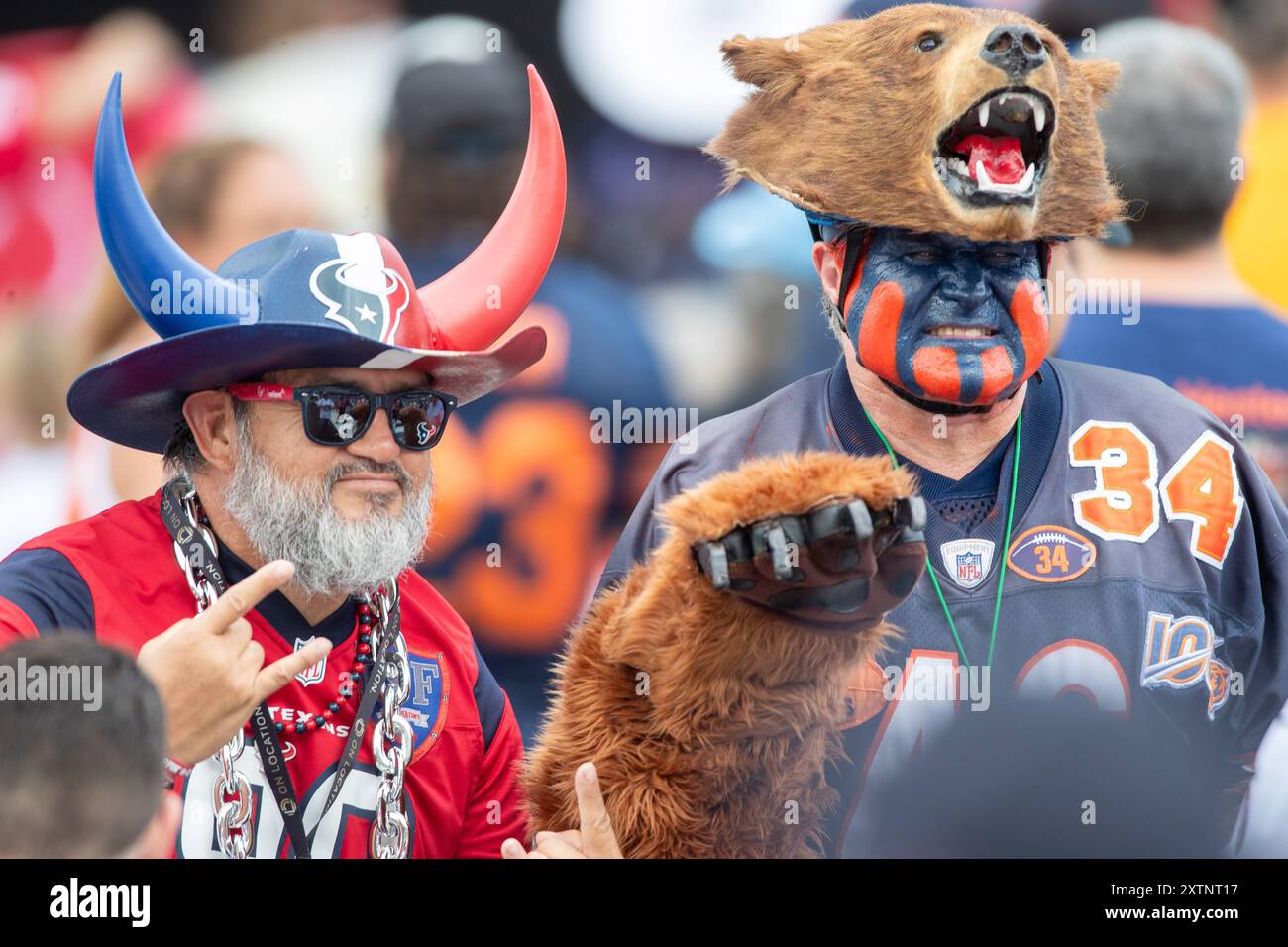 NFL Super Fans pose for a photo during the Pro Football Hall of Fame ...