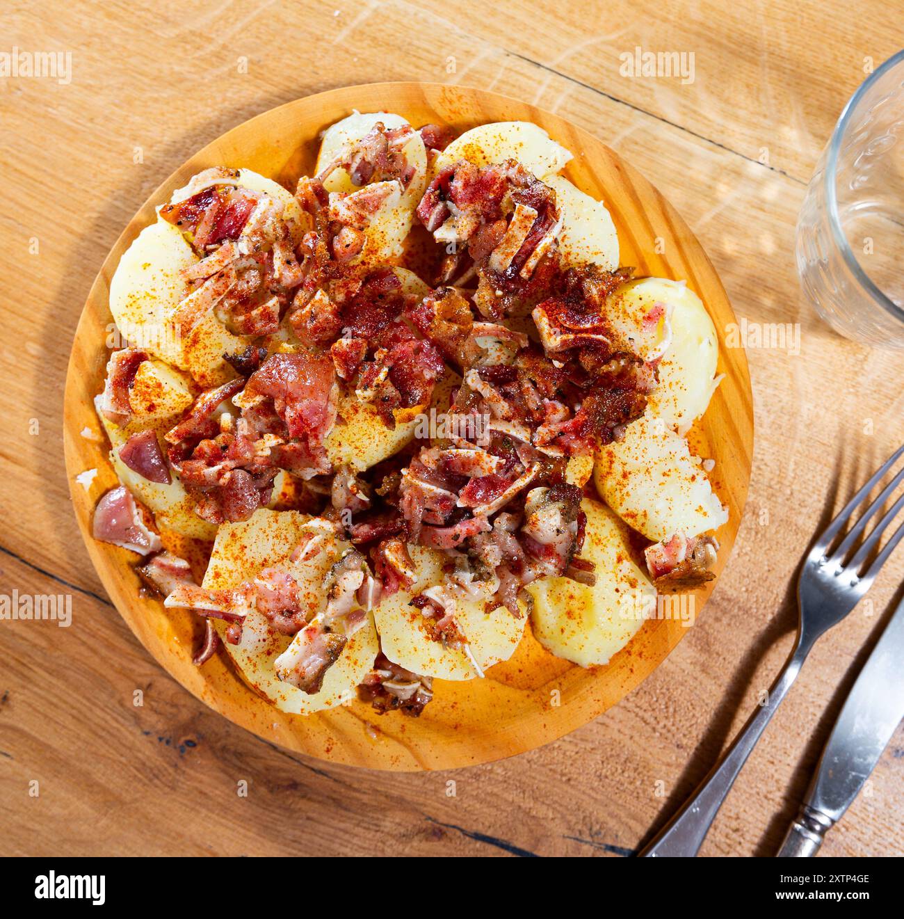 Pieces of pickled and boiled pork ears perfectly complement glass of ...