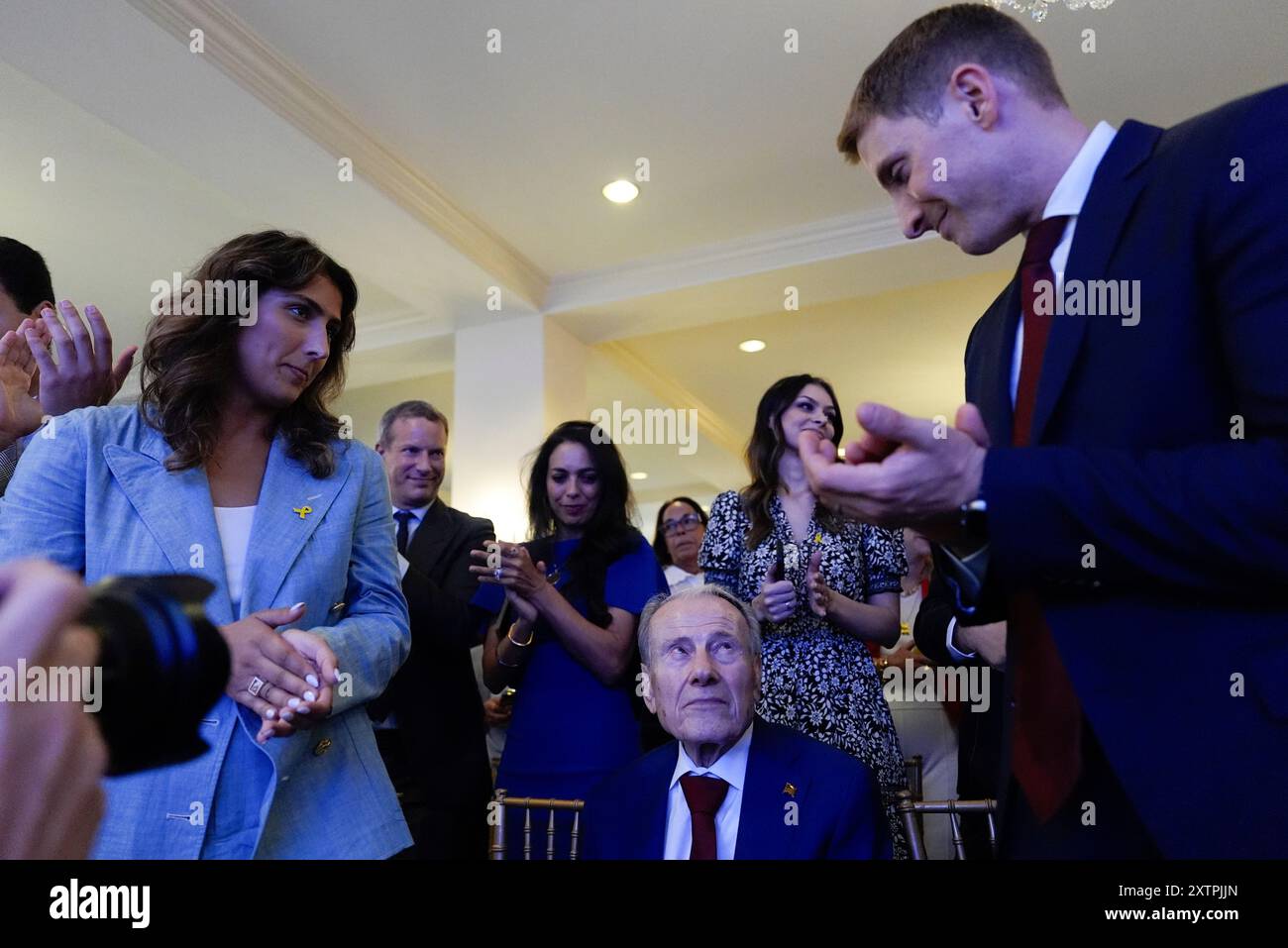 Guests applaud Auschwitz survivor Jerry Wartski during an event with ...