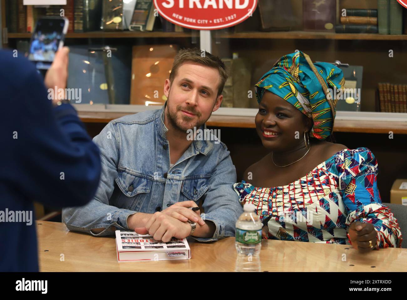 Ryan Gosling and Chouchou Namegabe sign copies of "Congo Stories" at ...
