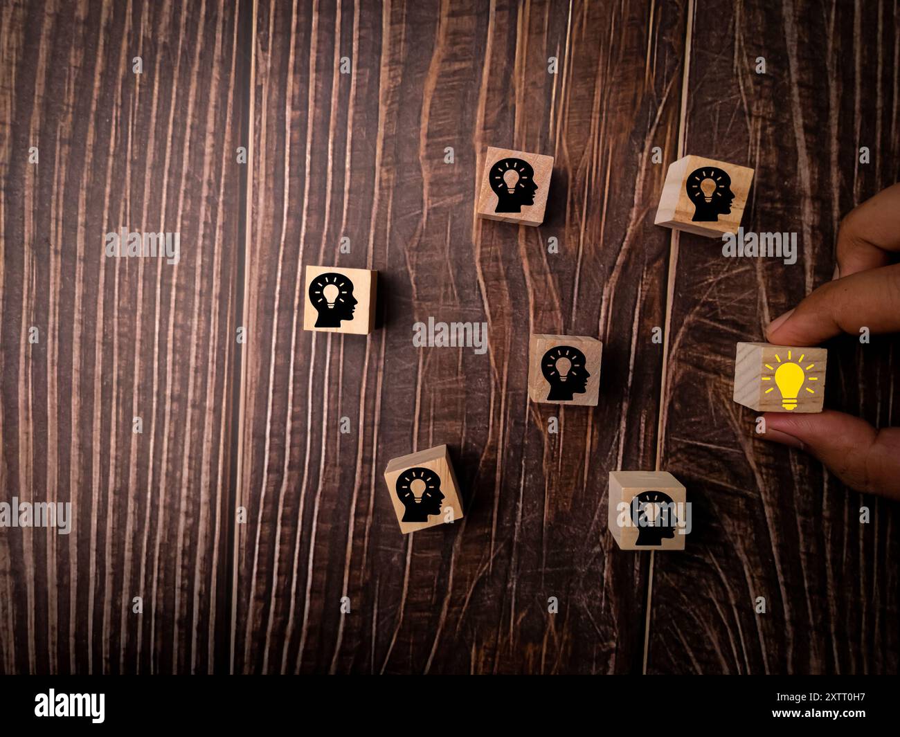 Creative thinking and brainstorming concept. Wooden cube with glowing ...