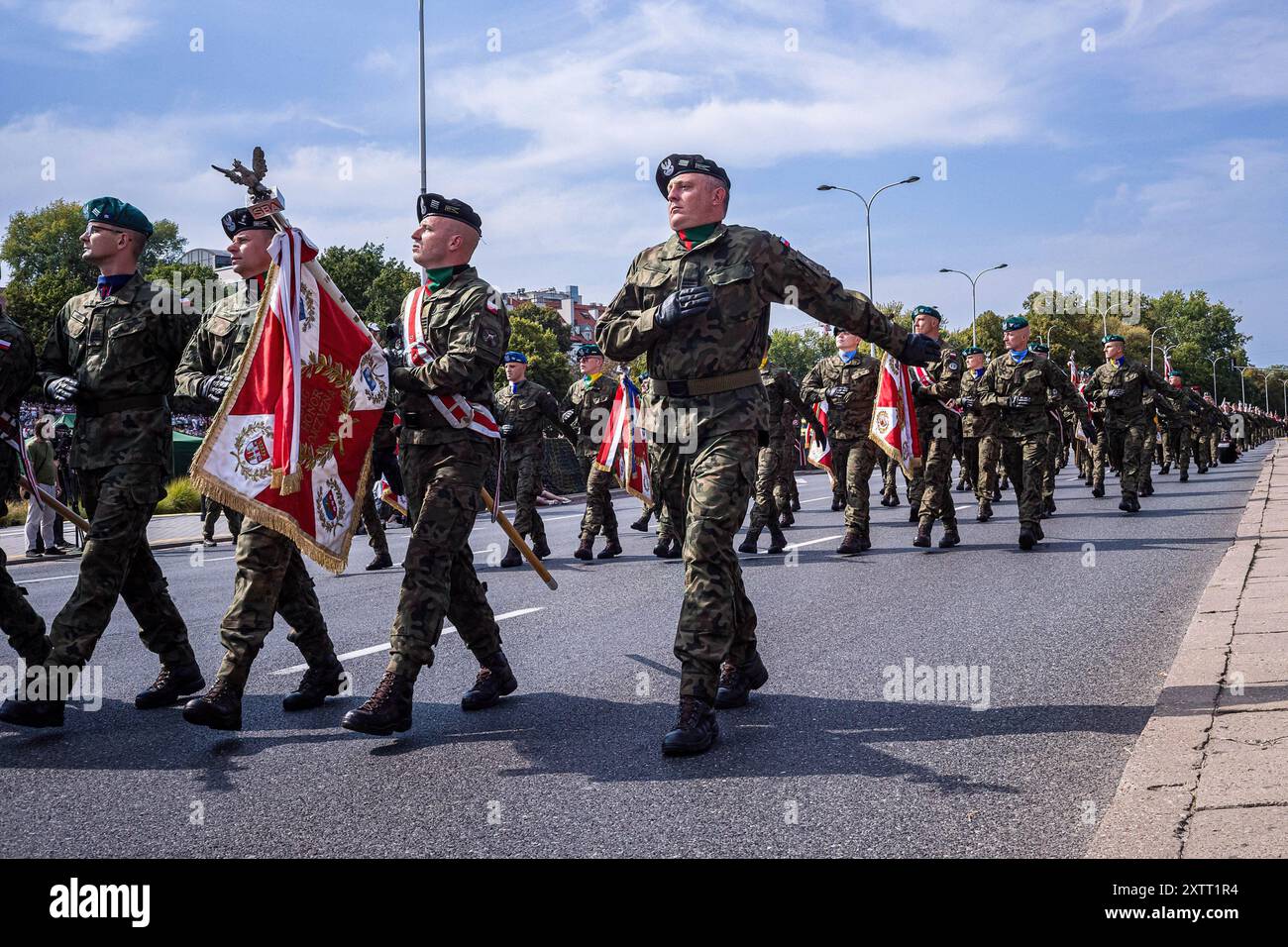 Polish soldiers march past the audience and towards the assembled ...