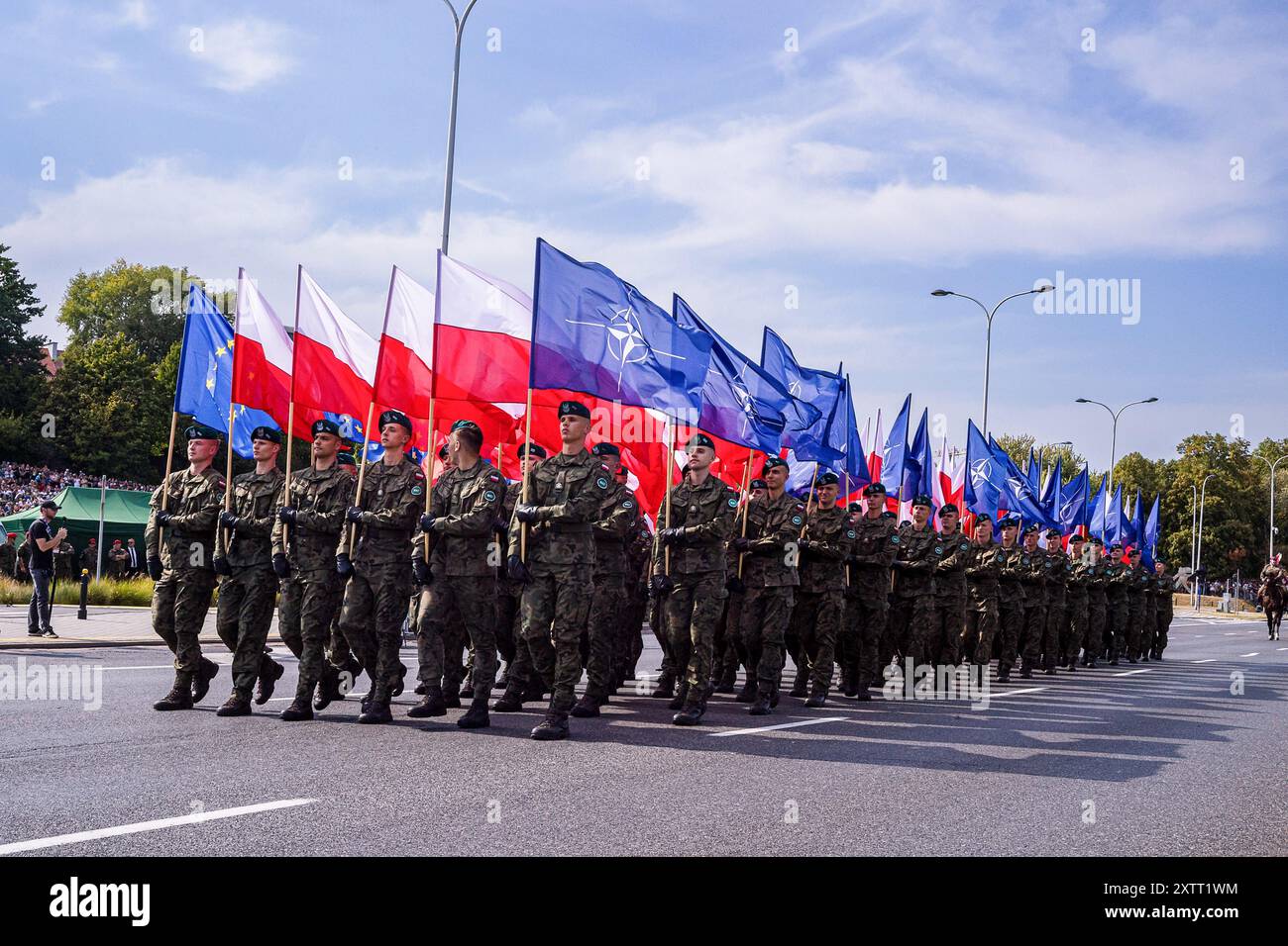 Soldiers carry an arrangement of the flag of the Republic of Poland and ...