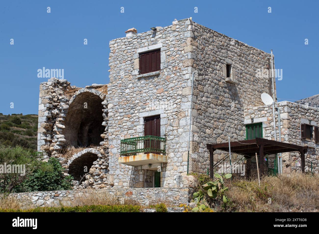 Traditional greek stone house with a modern touch, showcasing a blend ...