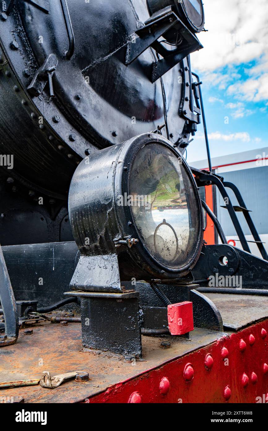 Detailed view of an old rusty steam train a vintage headlamp in a ...