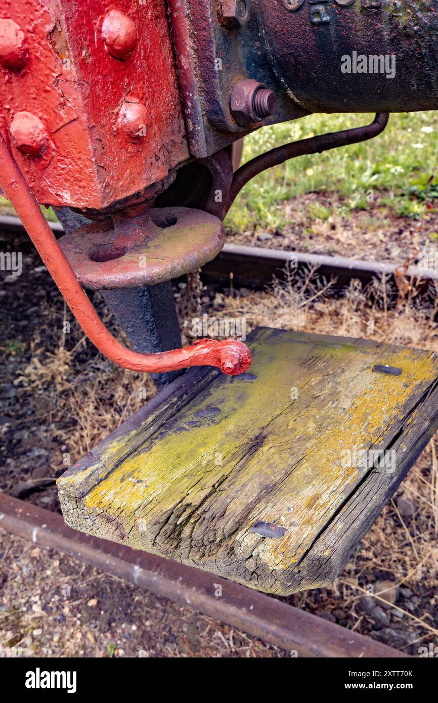Details of an old rusty steam train's coupling mechanism surrounded by ...