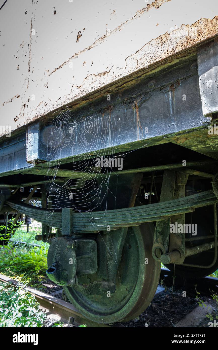 Details of an old rusty steam train weathered parts and a spider web ...