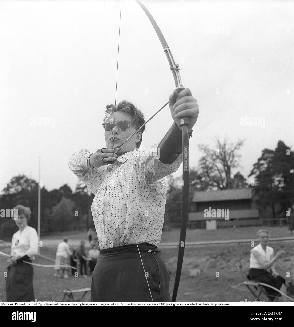 Archery 1957. A woman from the Stockholm archery club with her bow and ...