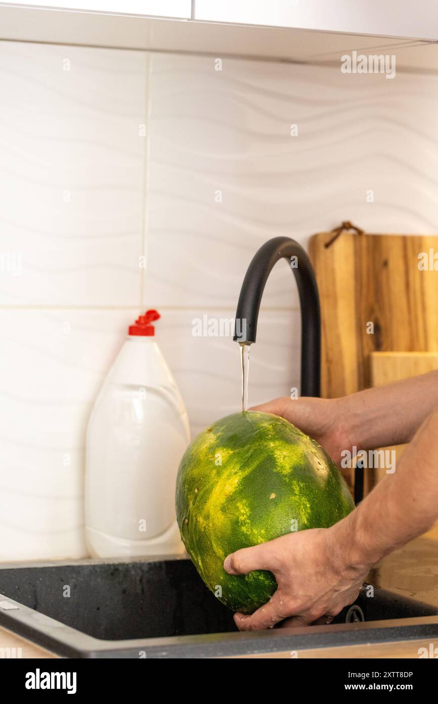 Hand washing watermelon hi-res stock photography and images - Alamy