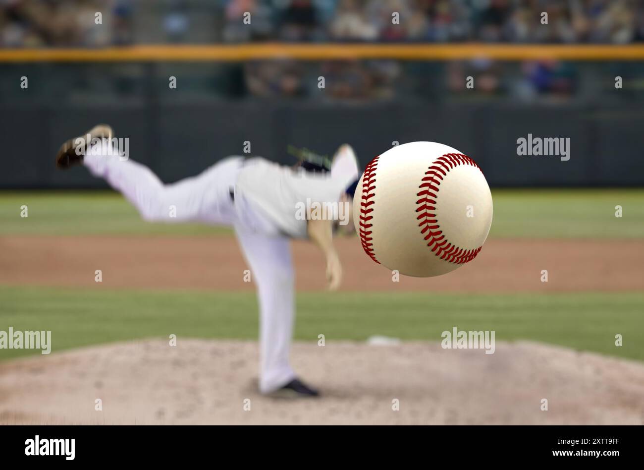 Baseball pitcher throwing fast ball to batter in a stadium Stock Photo ...