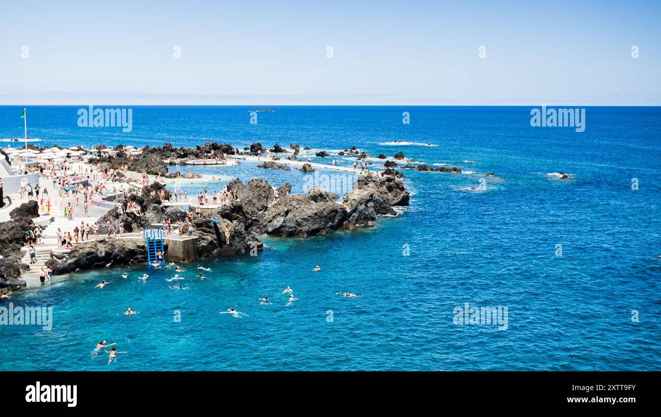 People seen swimming in the rock pools at Porto Moniz which are ...