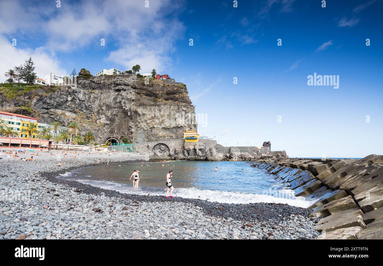 People enjoying the late afternoon sunshine in Ponta do Sol, Madeira on ...