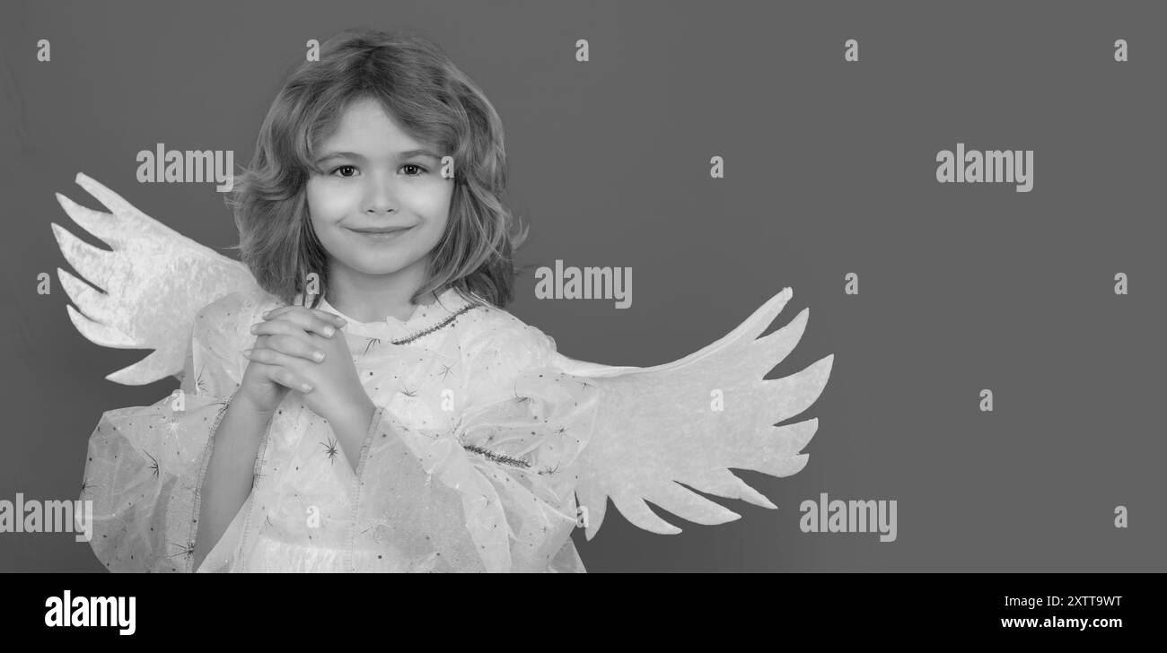 Child angel. Portrait of cute kid with angel wings isolated on studio ...