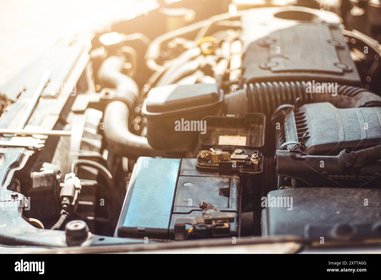 opened the car's bonnet, revealing the battery and engine. An ...