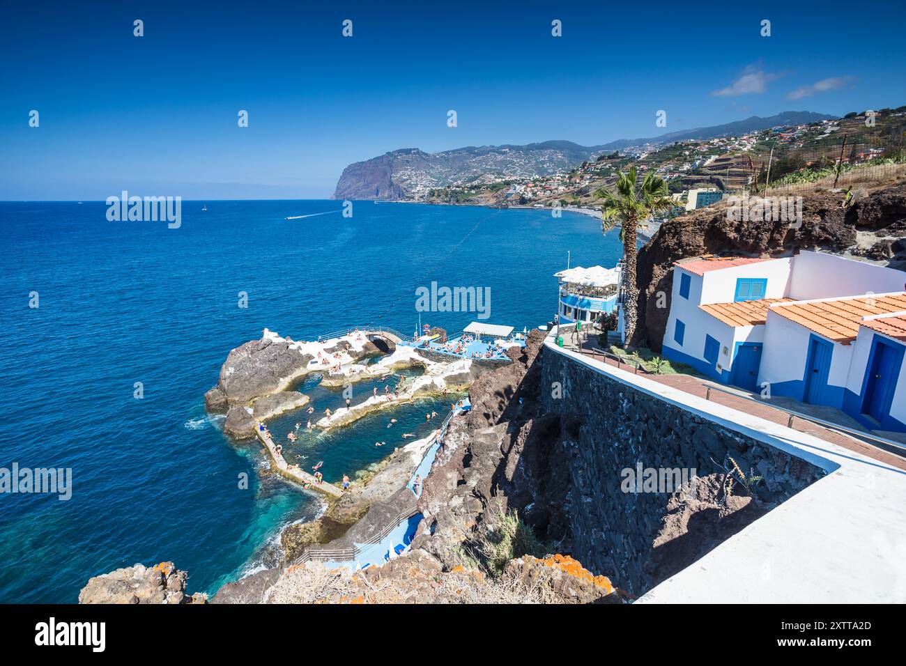 Locals enjopying the natural rock pools at the end of the Lido ...