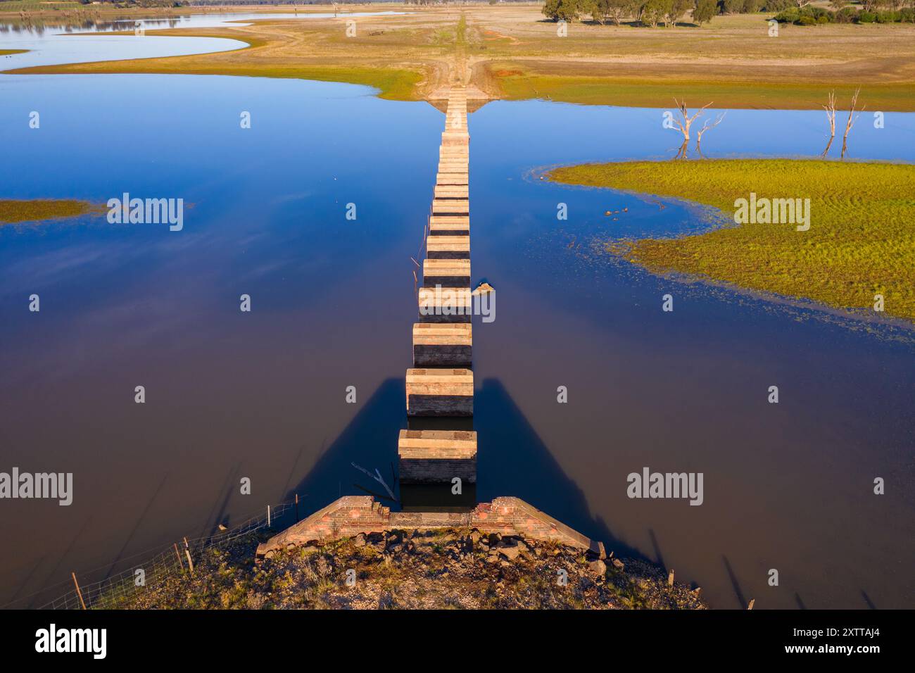 Aerial view of disued railway viaduct pillars crossing a drying ...