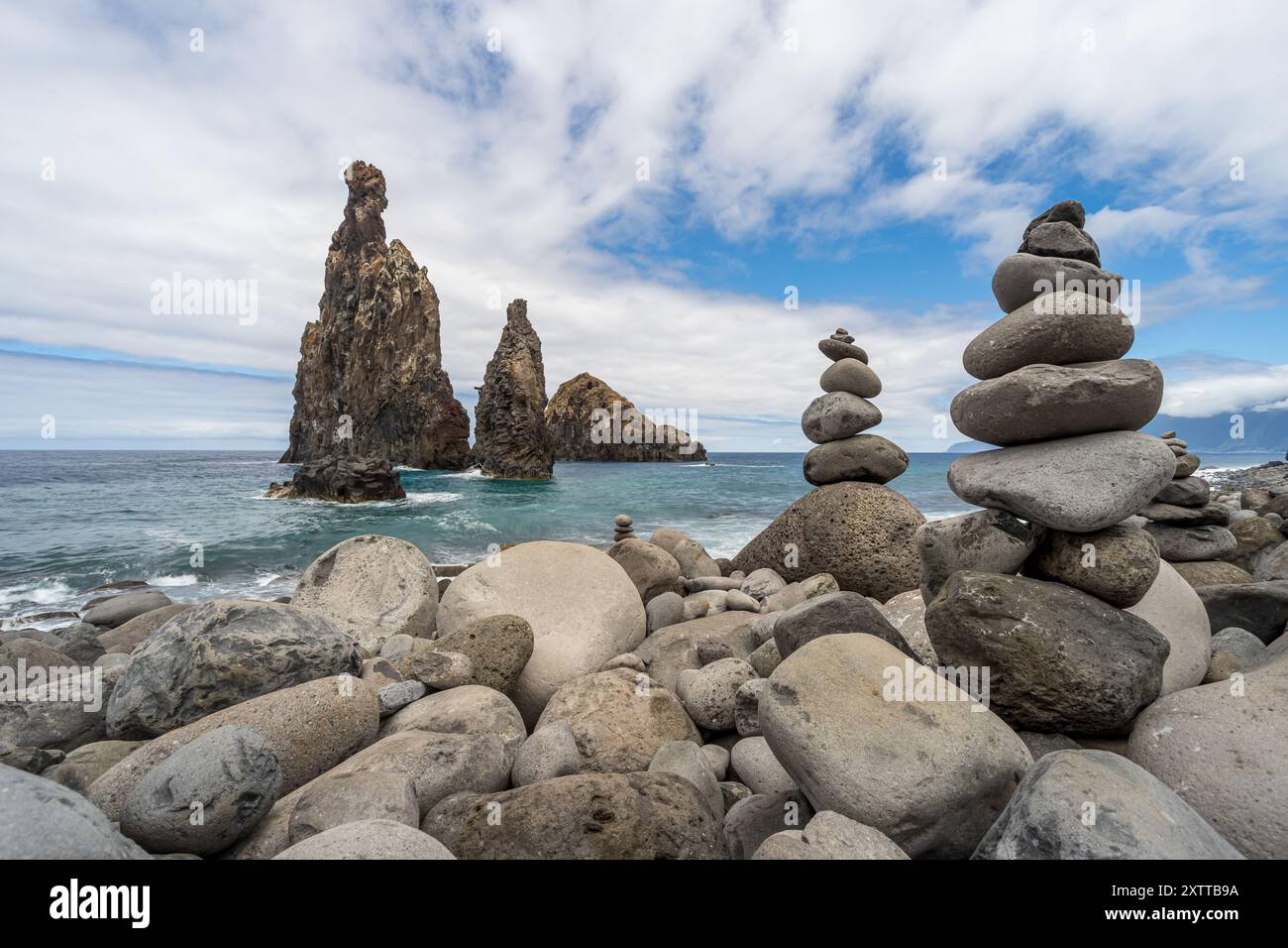 Small man made rock formations made from pebbles seen in front of ...