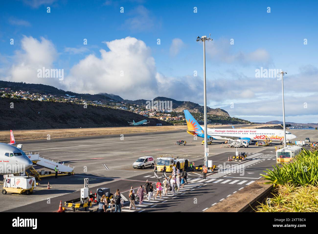 A German Condor aircraft takes off in the background as British ...