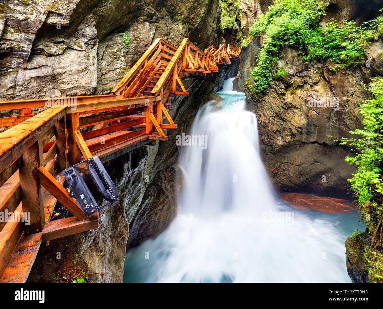 Wooden hike trail path inside a gorge with bue mountain river, Sigmund ...