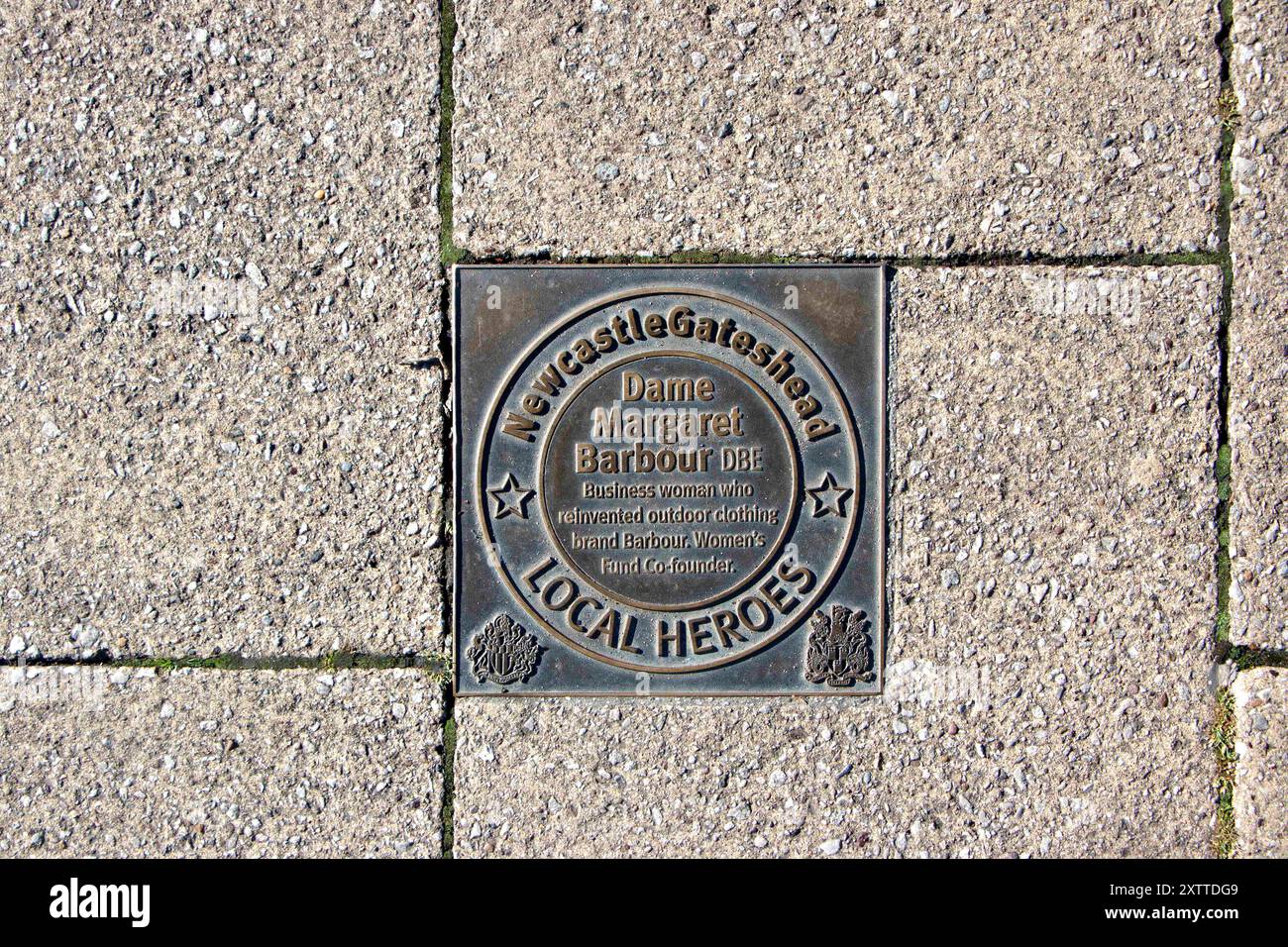 brass plaques to famous local heroes set in the quayside pavement in ...