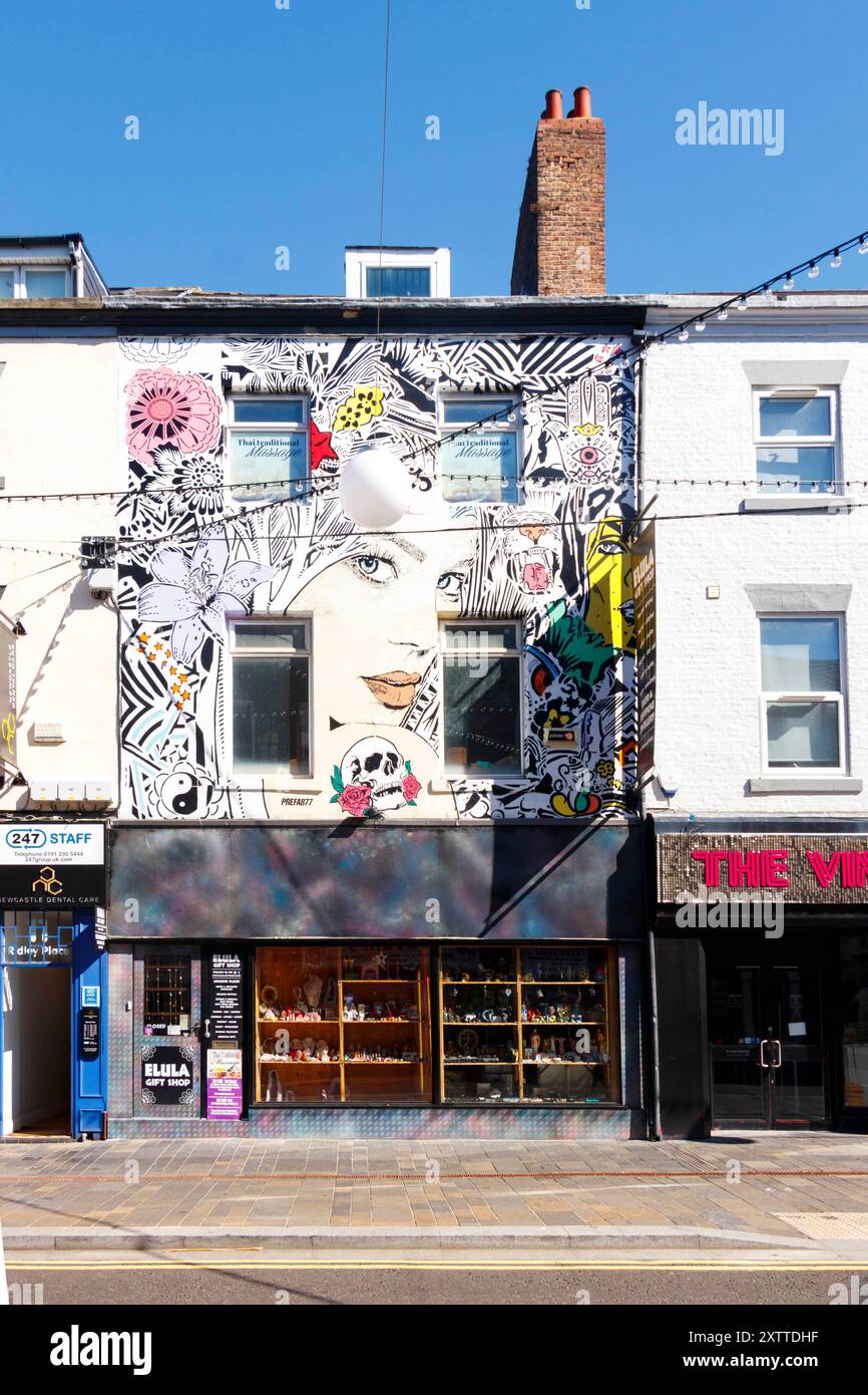 A vibrant urban street scene showcasing a building with colorful ...