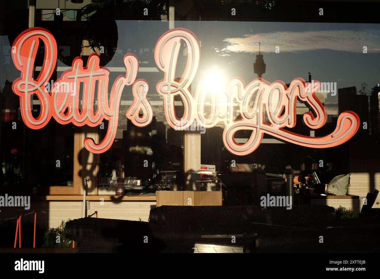 A reflection of the Sydney Skyline, Centrepoint Tower in the window of ...