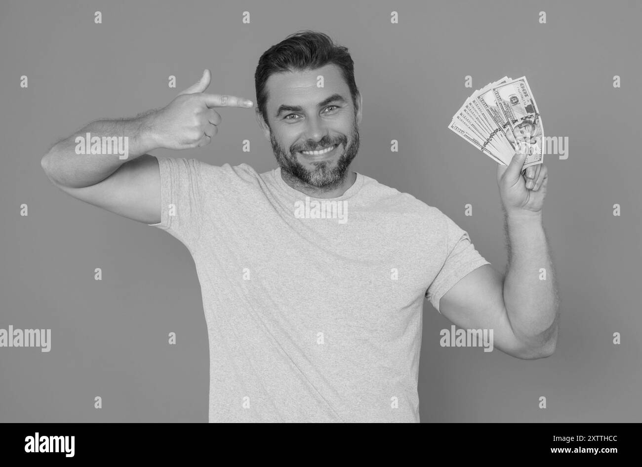 Handsome man pointing dollar Black and White Stock Photos & Images - Alamy