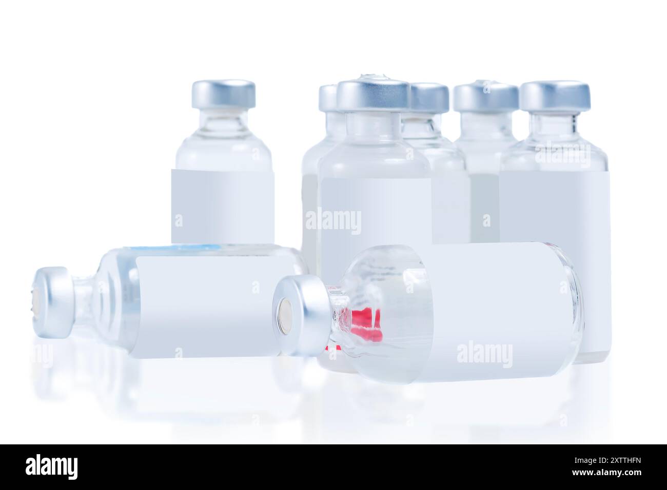 Vaccine medical vials isolated on white background with reflection Stock Photo - Alamy