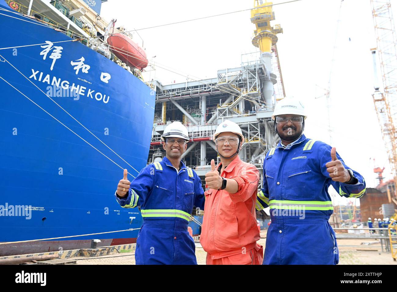 QINGDAO, CHINA - AUGUST 16, 2024 - Chinese and foreign engineers pose ...