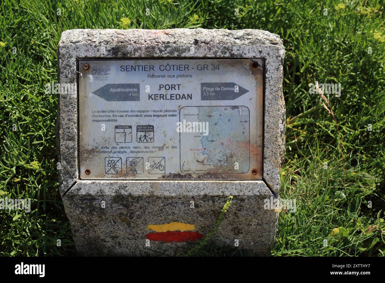 Stone marker with footpath sign (GR340) at Port de Kerledan, Belle Ile ...