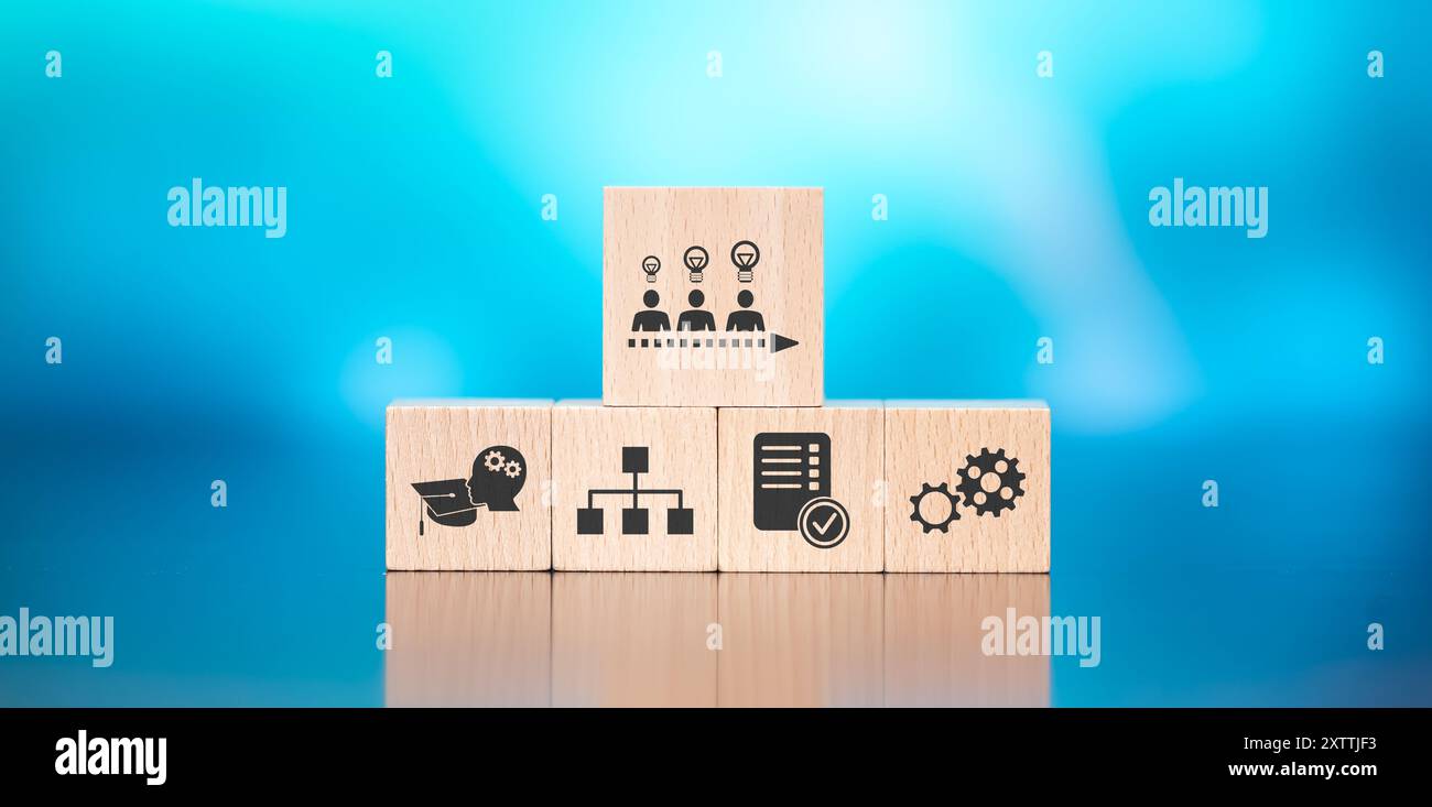 Wooden blocks with symbol of continuing education concept on blue ...